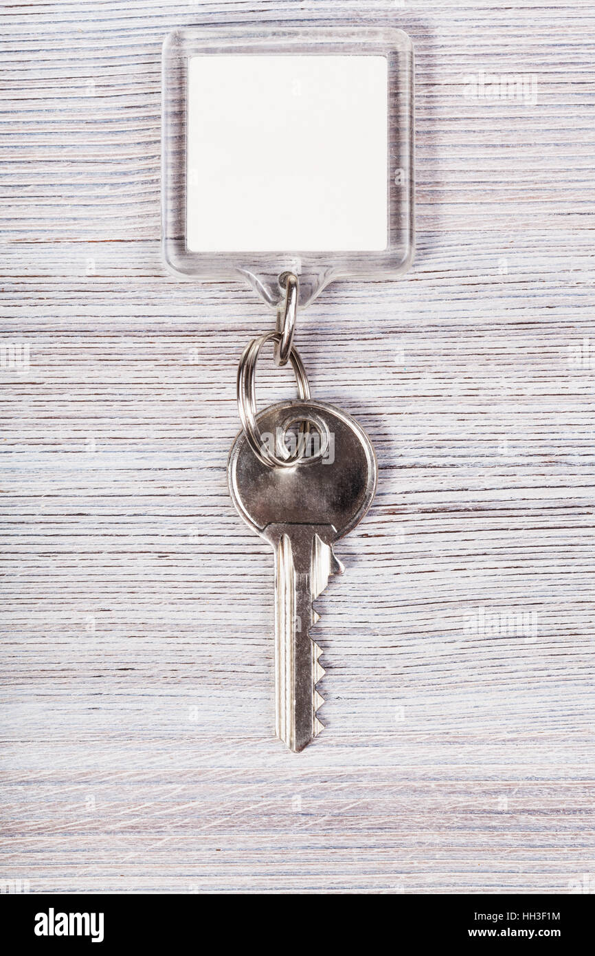 door key with white blank keychain on wood table Stock Photo - Alamy