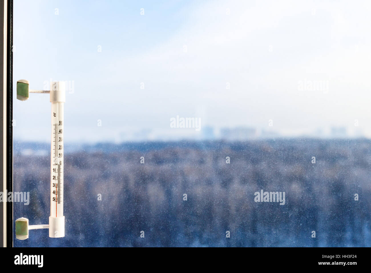 outdoor thermometer with minus 25 degrees celsius temperature on window ...