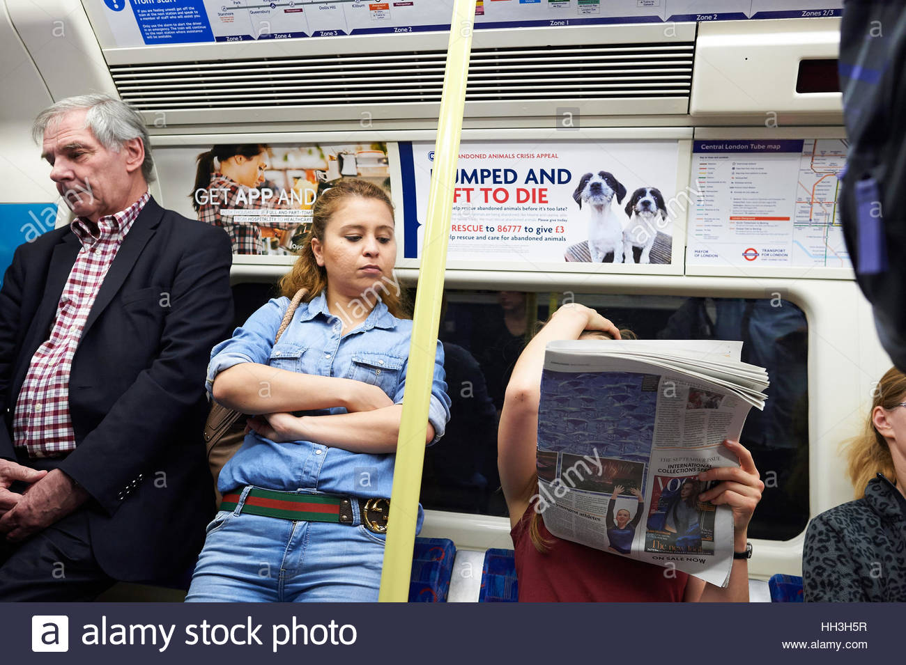 Reading Newspaper On Subway High Resolution Stock Photography and ...