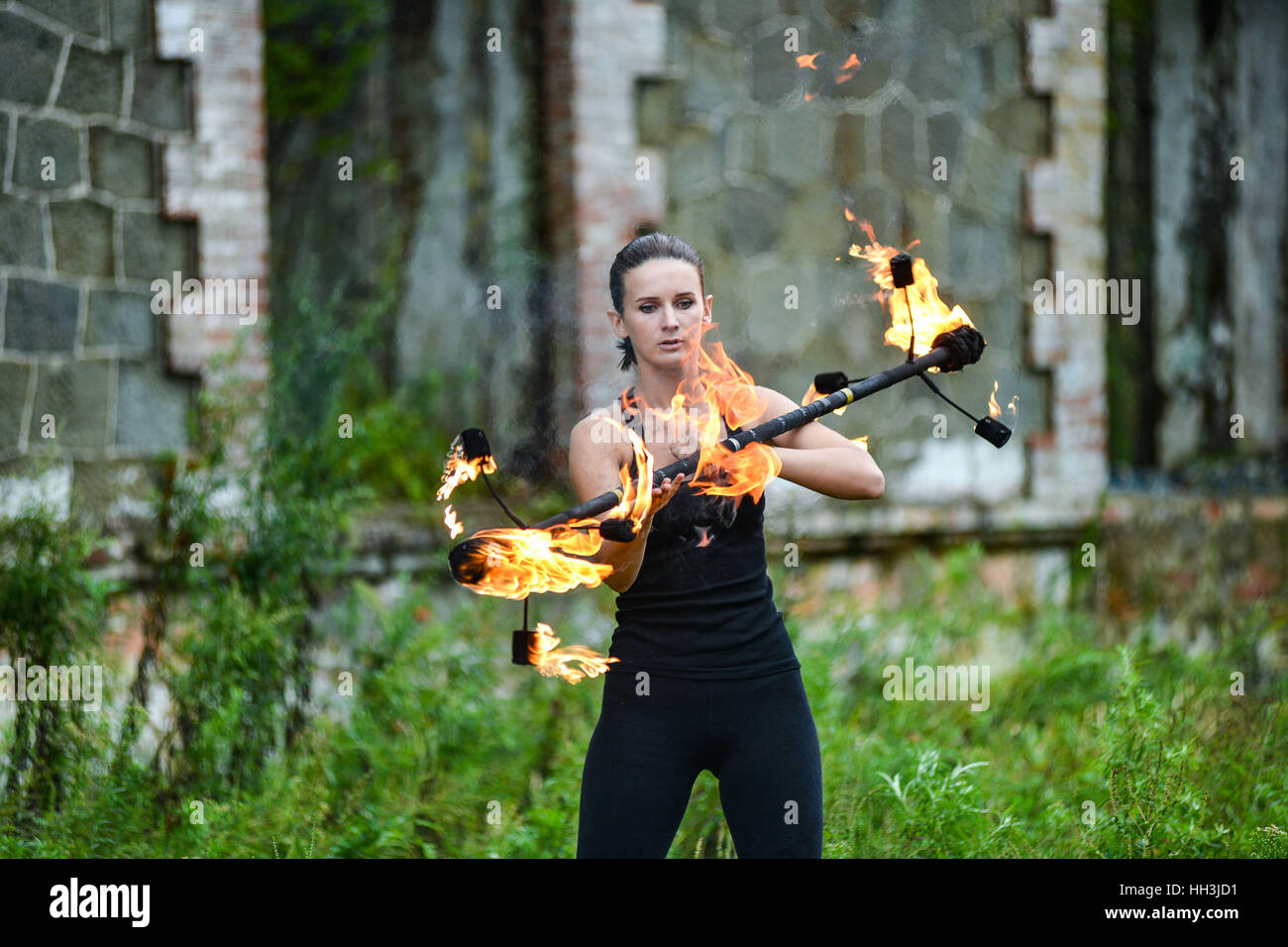 play with fire show on the shore of the sea Stock Photo - Alamy