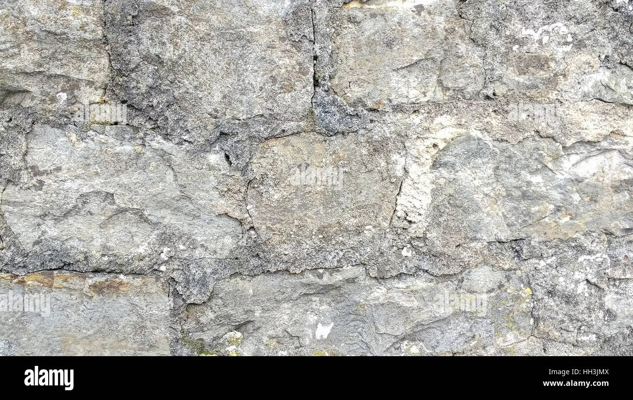 Rough stone wall texture background Stock Photo - Alamy