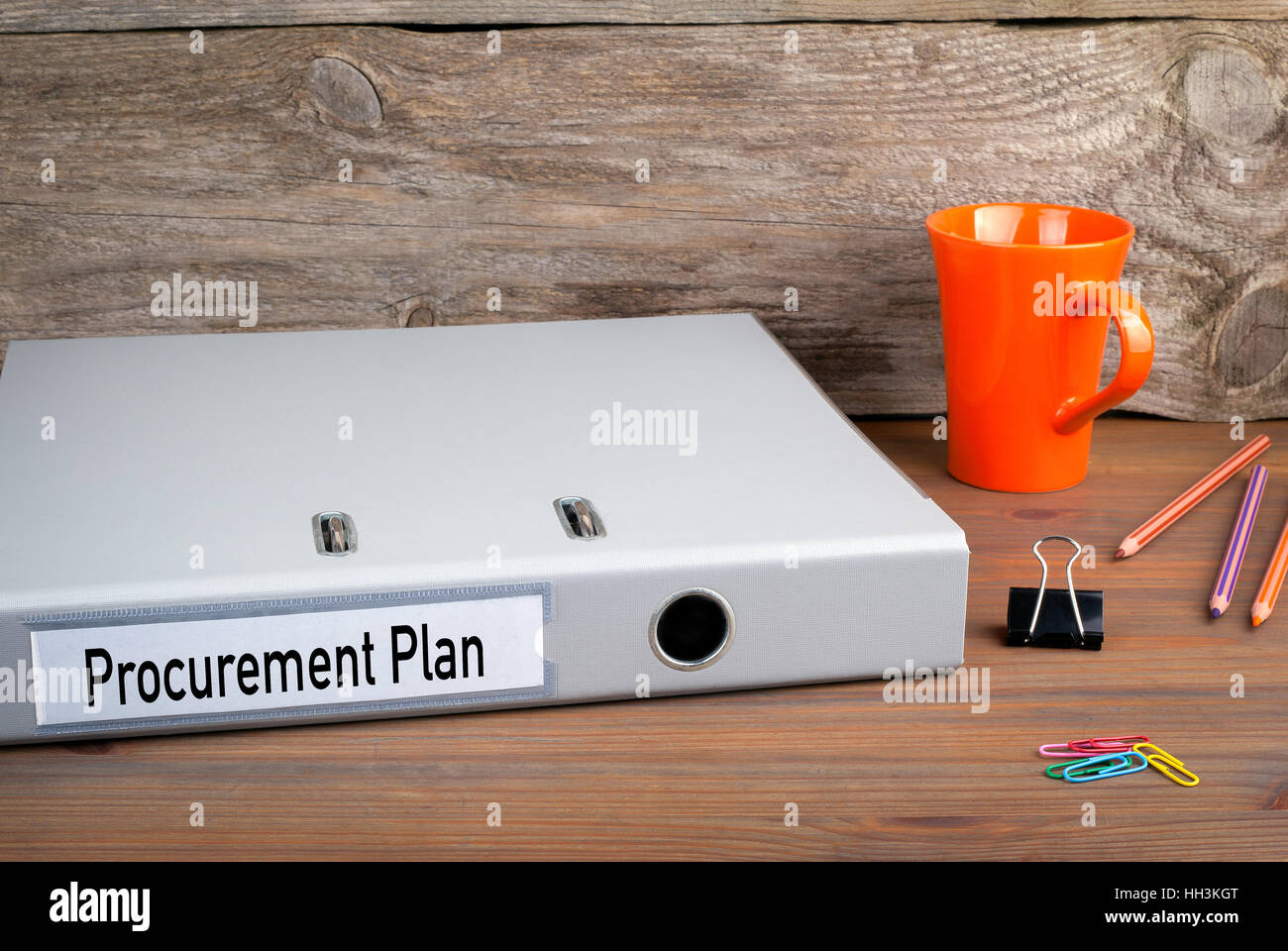 Procurement Plan - folder on wooden office desk Stock Photo - Alamy