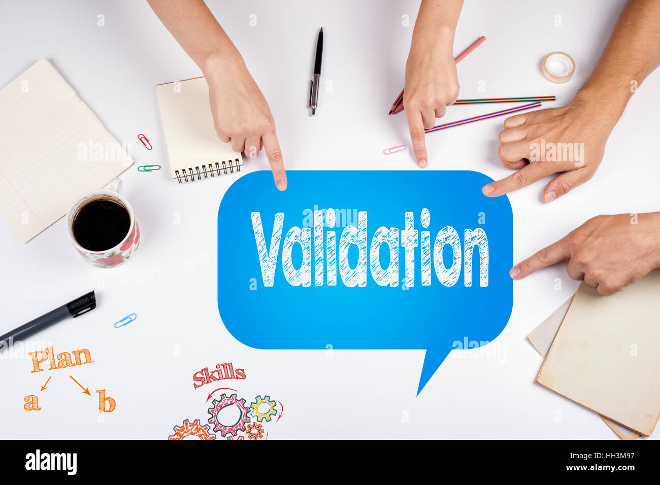 Validation concept office desk Stock Photo - Alamy