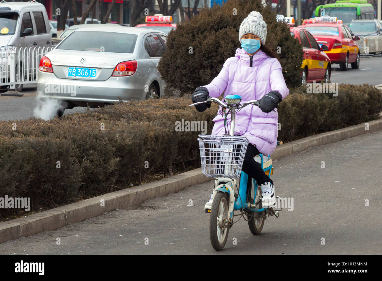 Girl riding an eBike in Shizuishan, Ningxia province, China Stock Photo ...