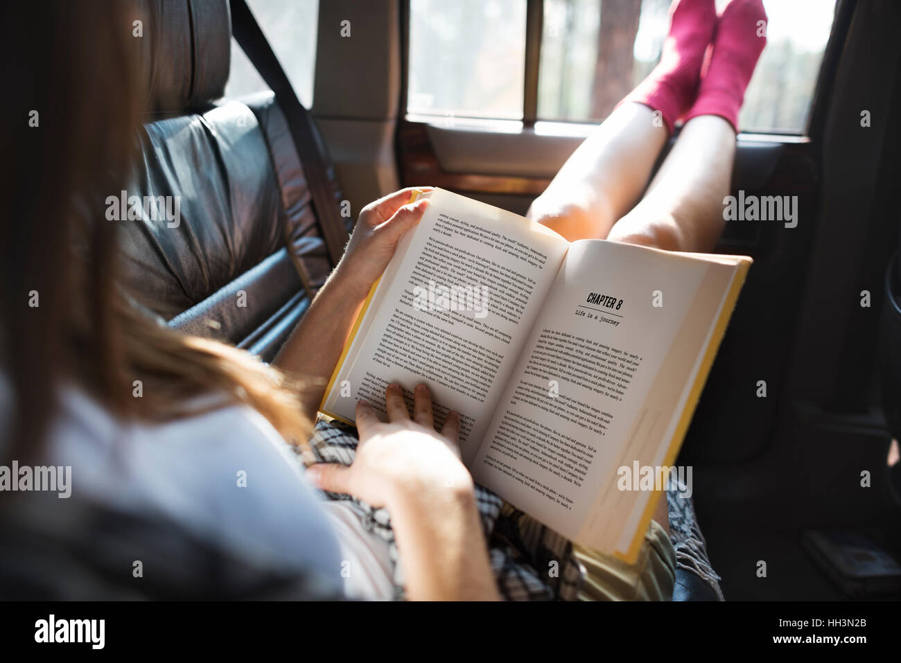Girl Reading Book Road Trip Concept Stock Photo - Alamy