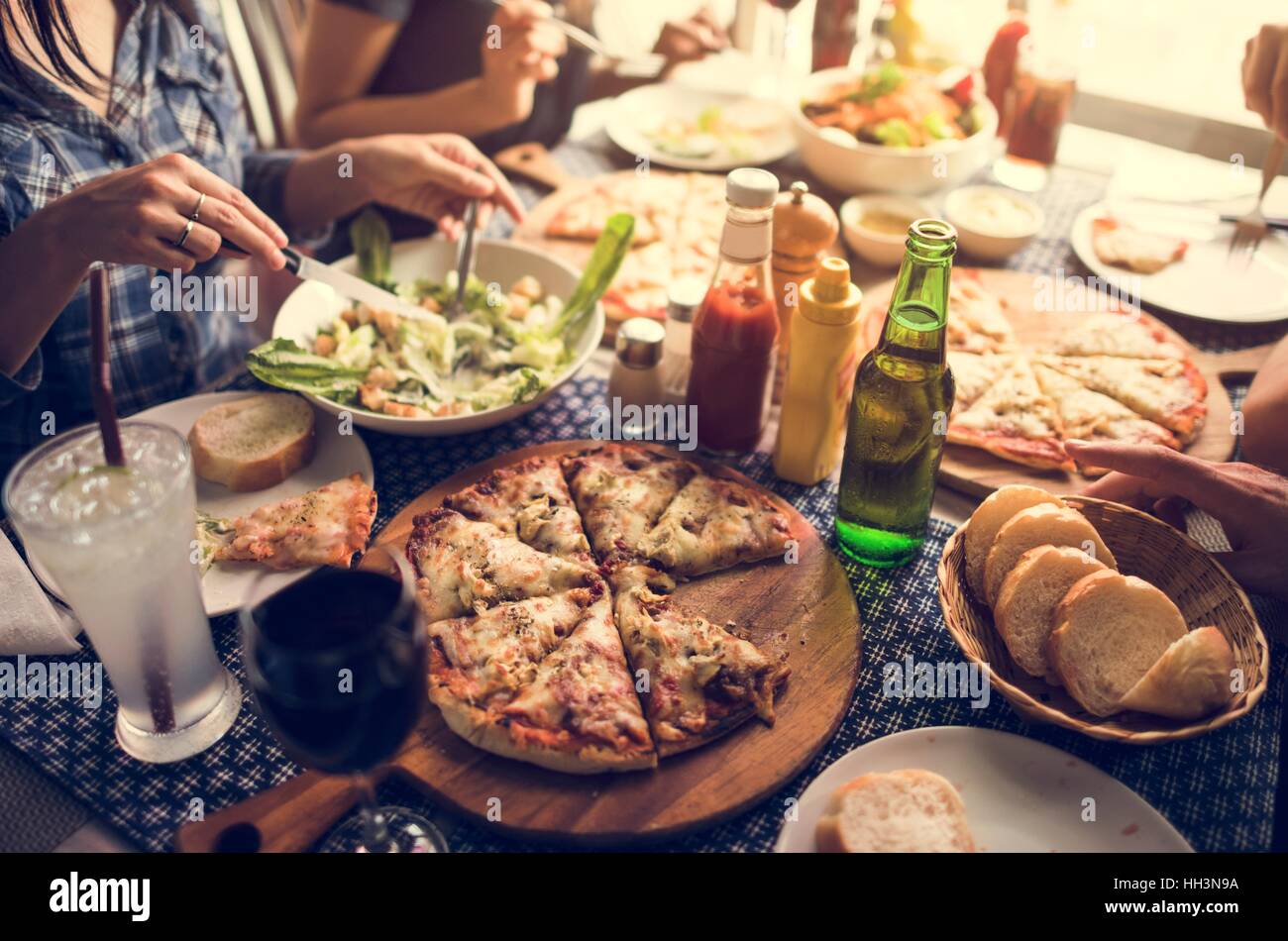 Friends Eating Pizza Party Together Concept Stock Photo - Alamy