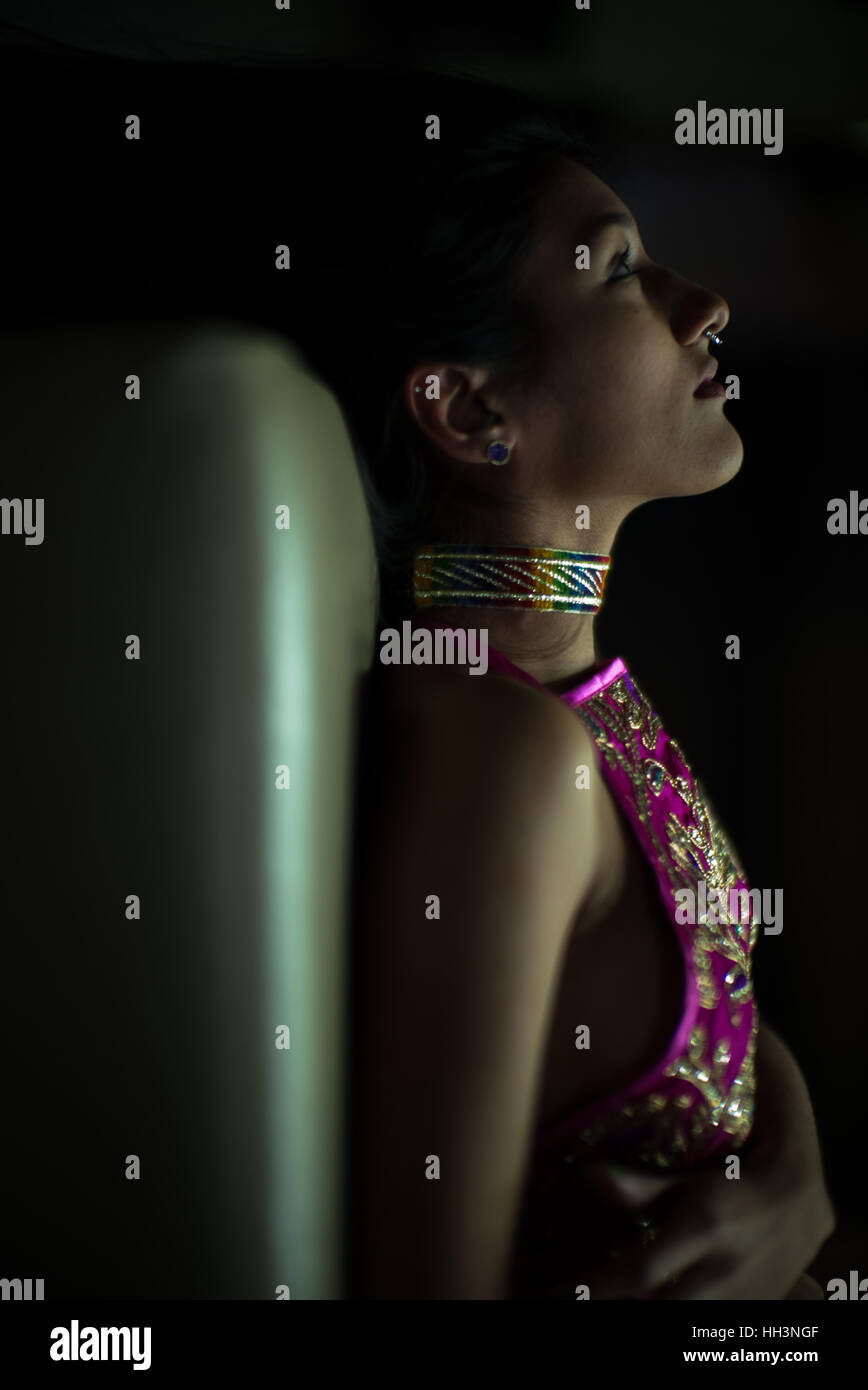 Model posing at the Barbican Centre, London UK. Fashion editorial shoot ...