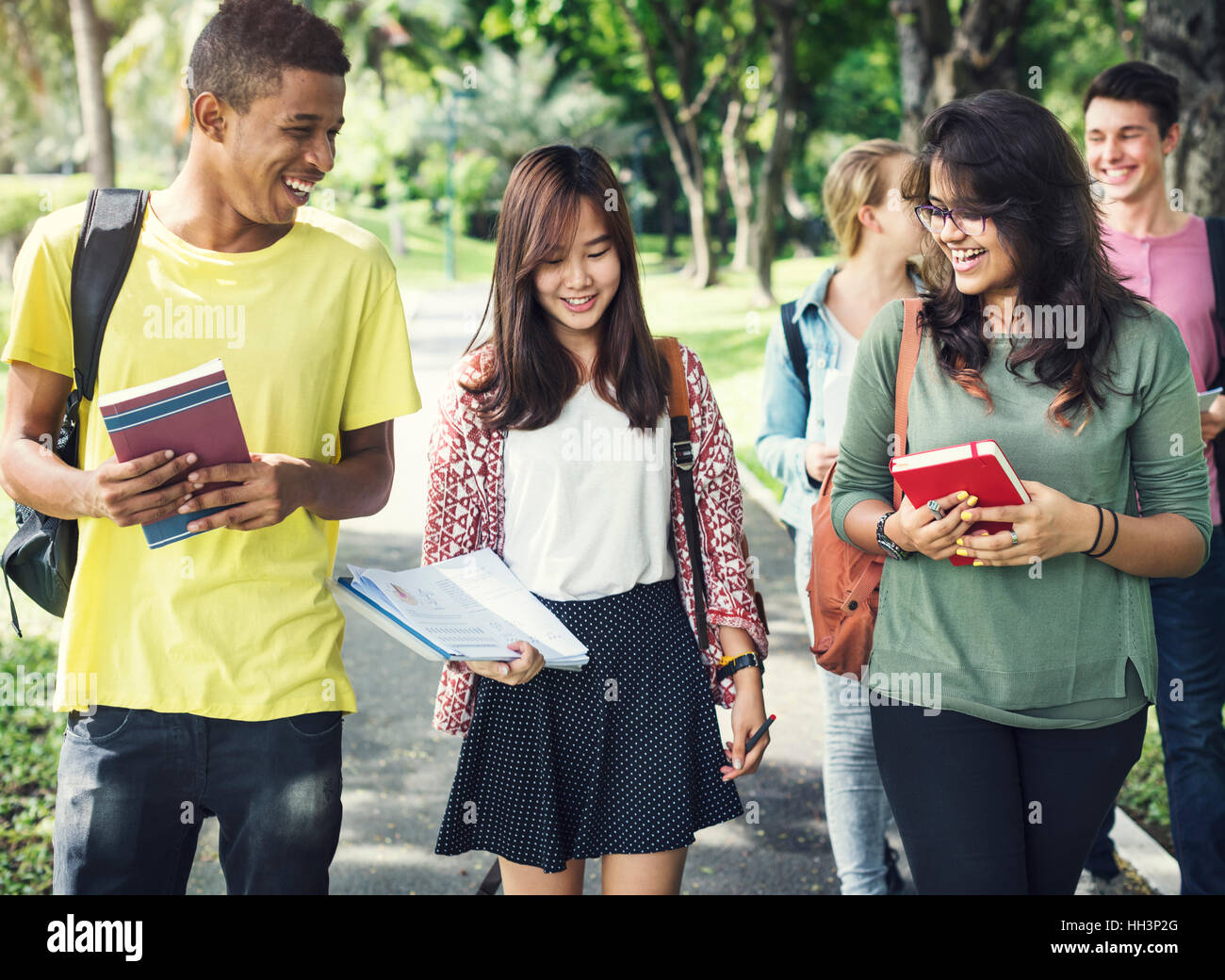 Diverse Young Students Book Outdoors Concept Stock Photo - Alamy