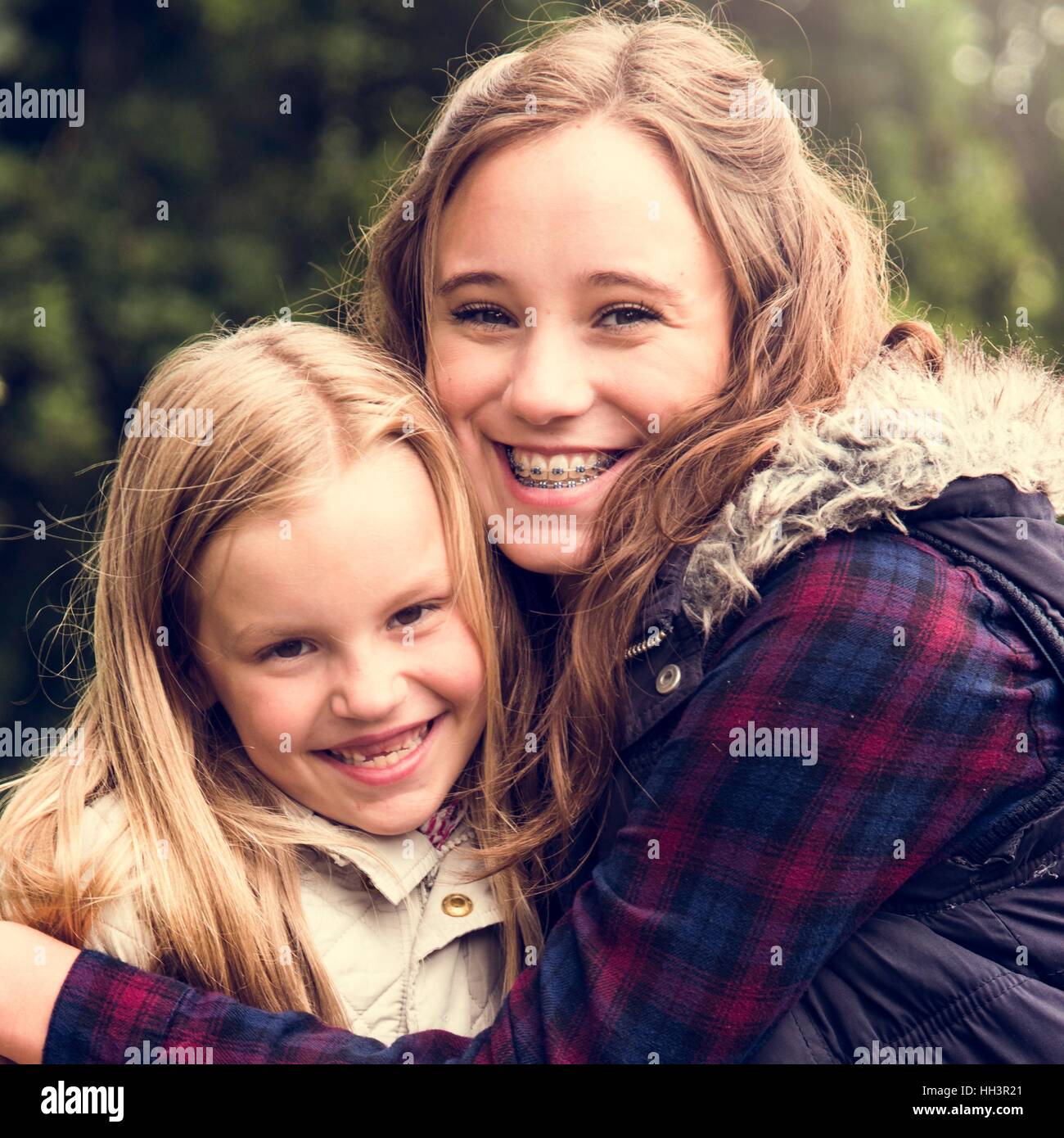 Sister Hug Togetherness Outdoors Girls Concept Stock Photo - Alamy