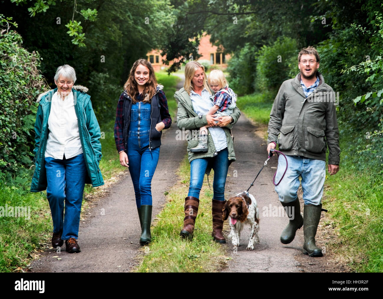 Family Walking Dog Togetherness Nature Concept Stock Photo - Alamy