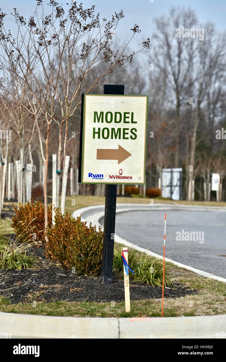 A model home sign directing traffic to a new housing development Stock ...