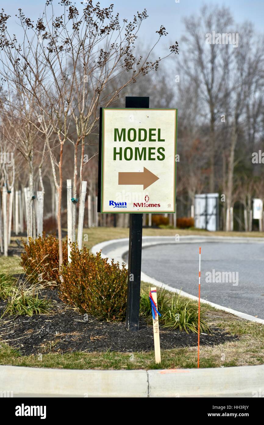 A model home sign directing traffic to a new housing development Stock ...