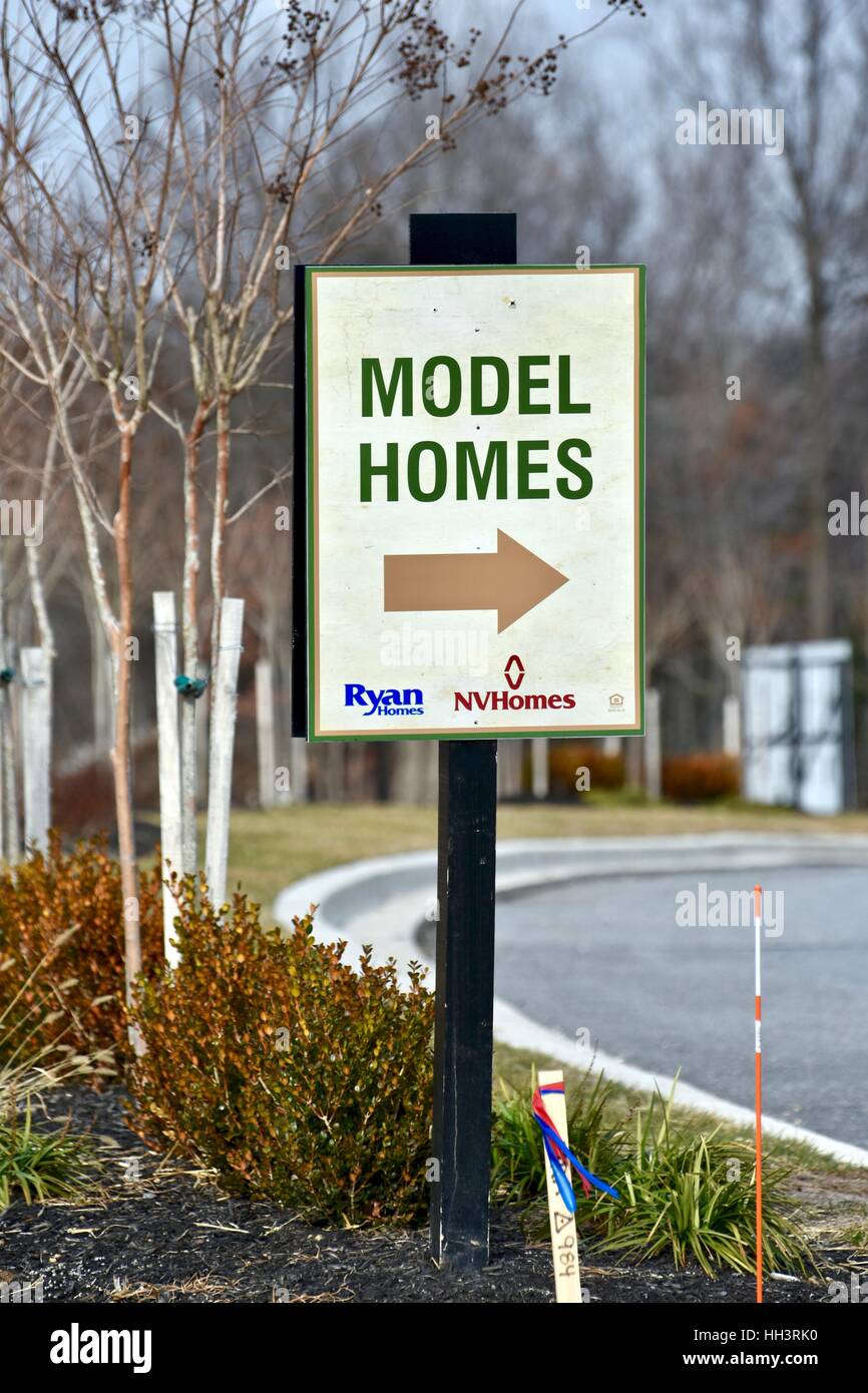 A model home sign directing traffic to a new housing development Stock ...