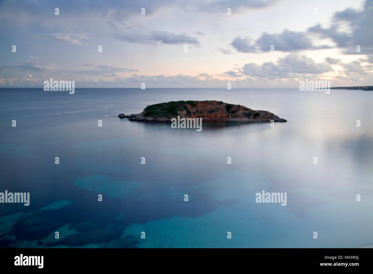 seascape calm water isle scene, long exposure blur clear water and sky ...