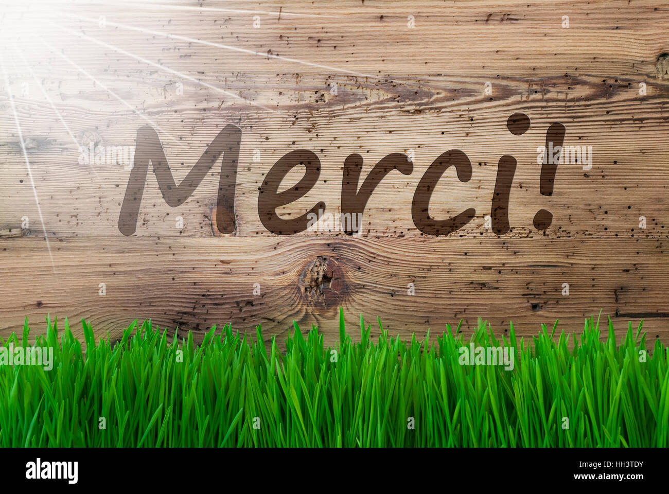 Sunny Wooden Background, Gras, Merci Means Thank You Stock Photo - Alamy