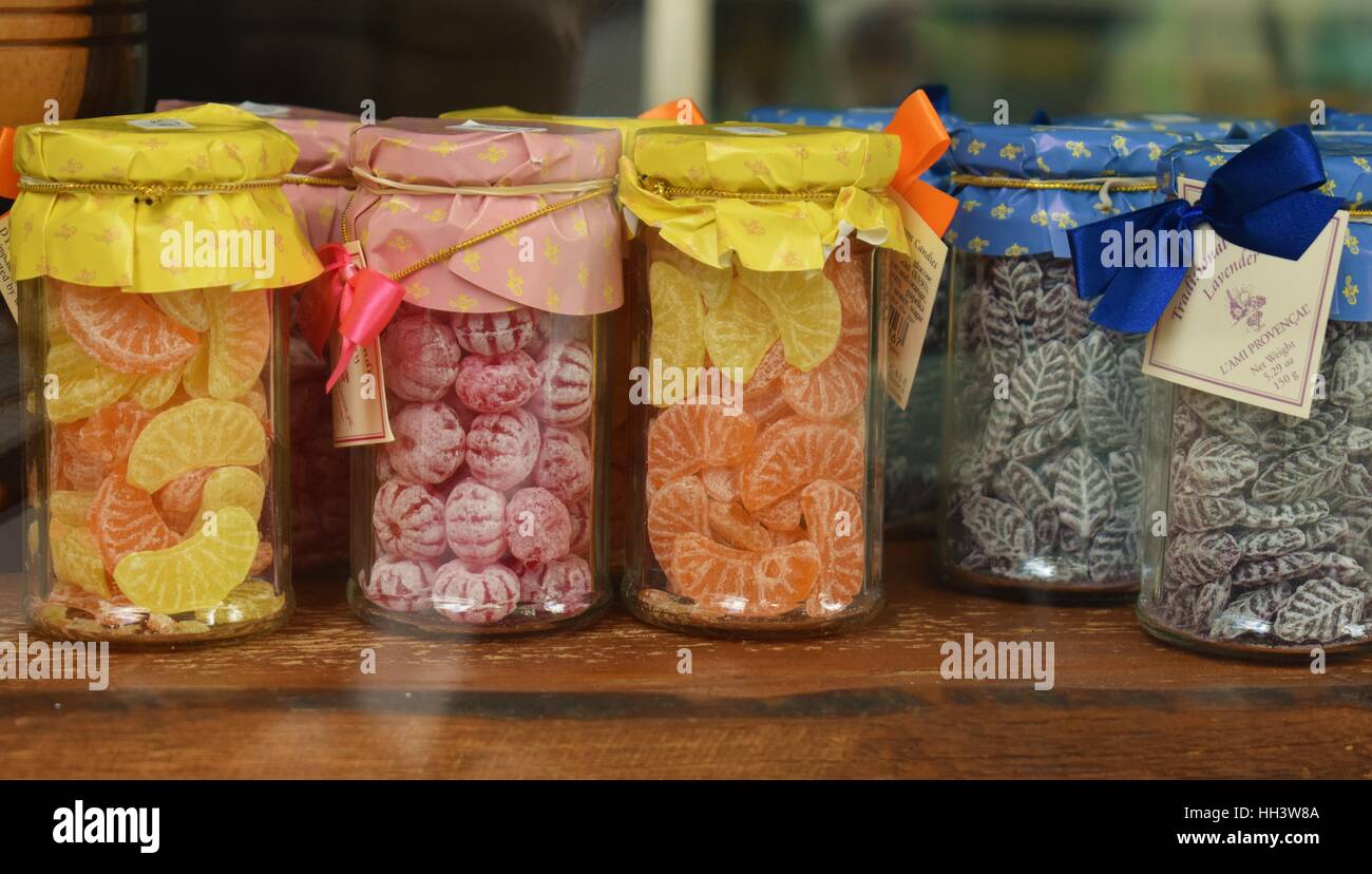 brightly colored confectionery in sweet shop window Stock Photo - Alamy