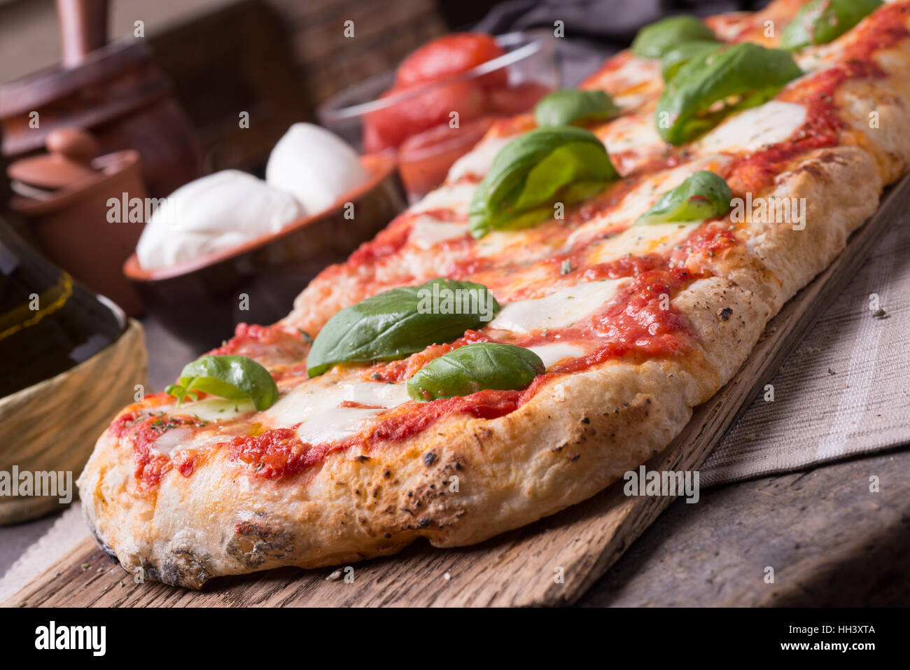 Rectangular shape and thick hand made romana's pizza Stock Photo - Alamy