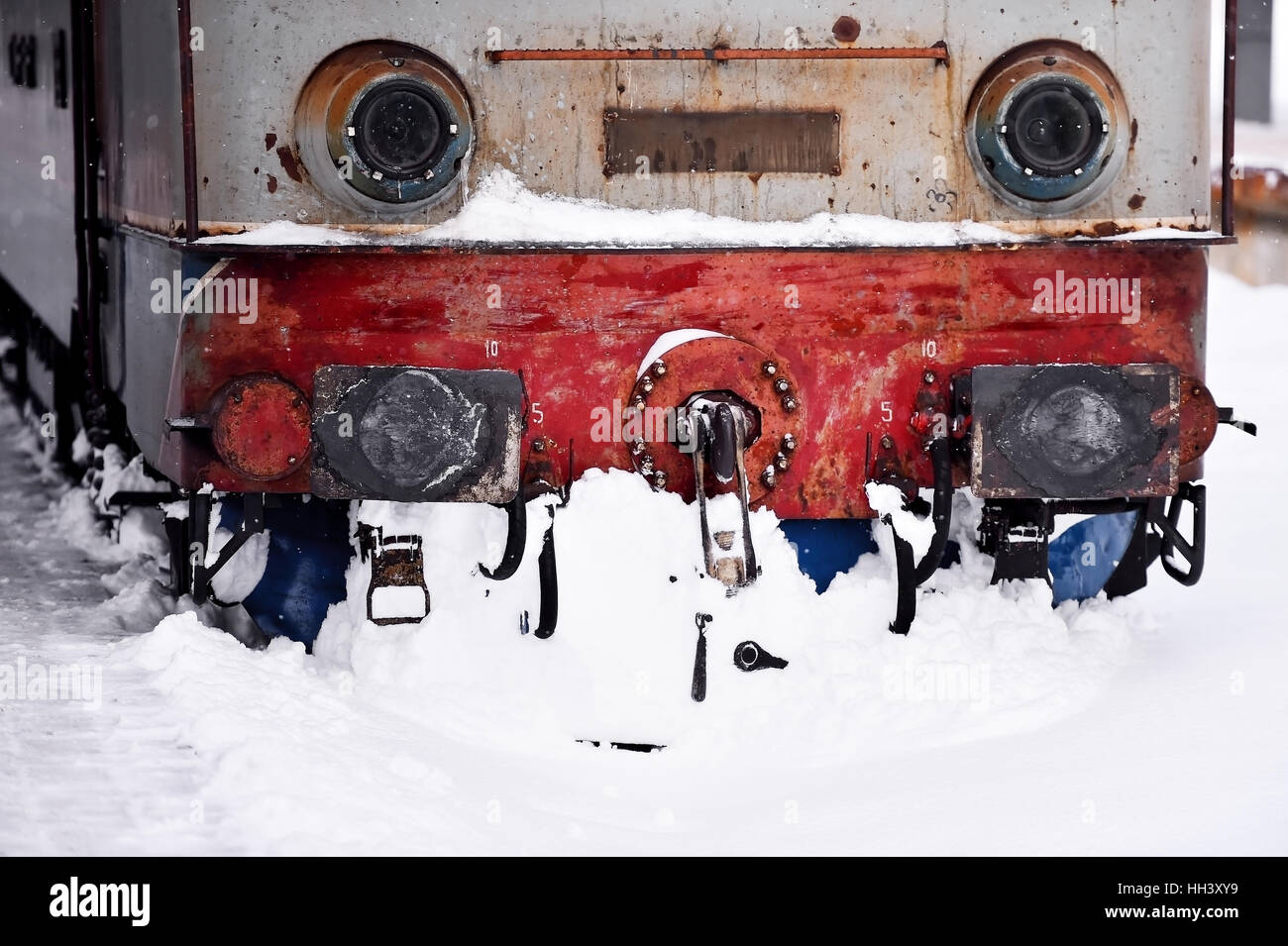Old train locomotive stuck in train station after heavy snowfall Stock ...