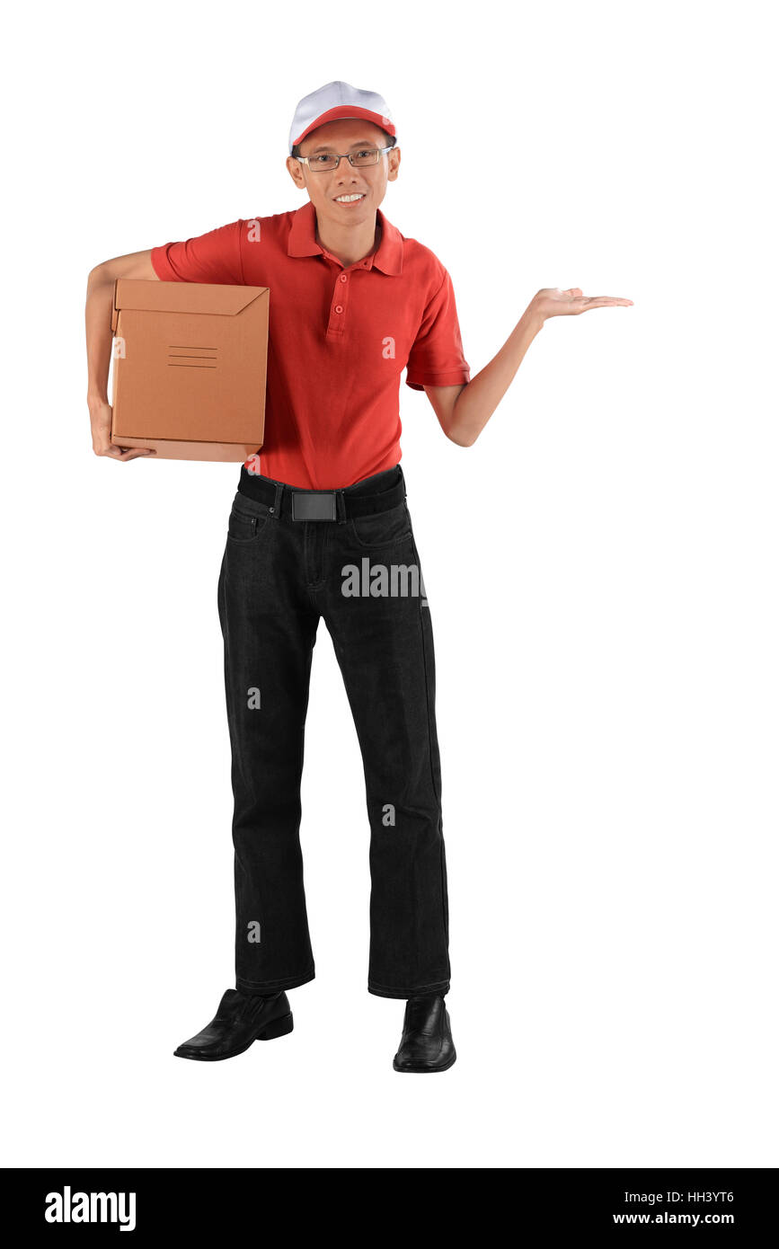 Asian delivery man holding package showing empty open hand isolated ...