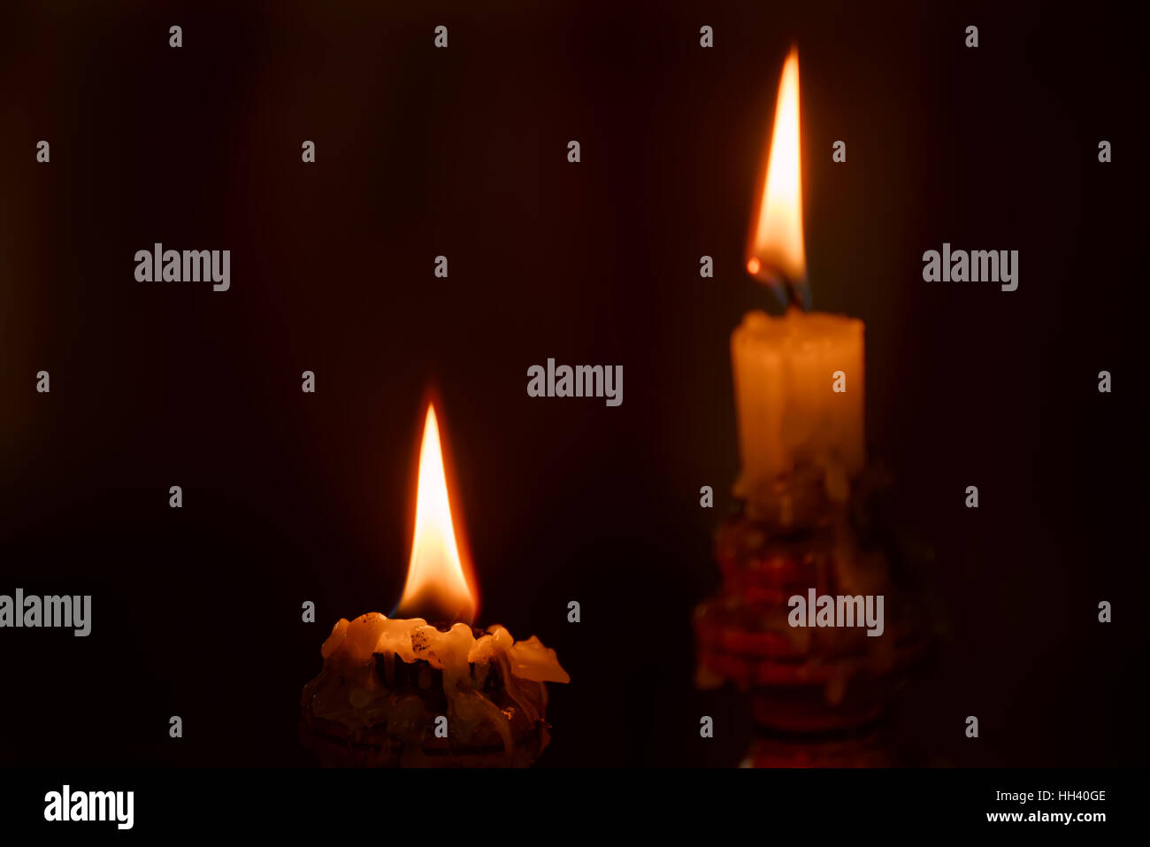 Two candles burning Stock Photo - Alamy