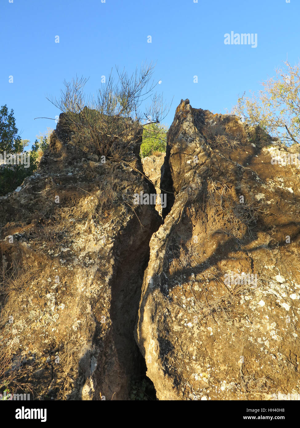 large rock split in two on rural path Stock Photo - Alamy
