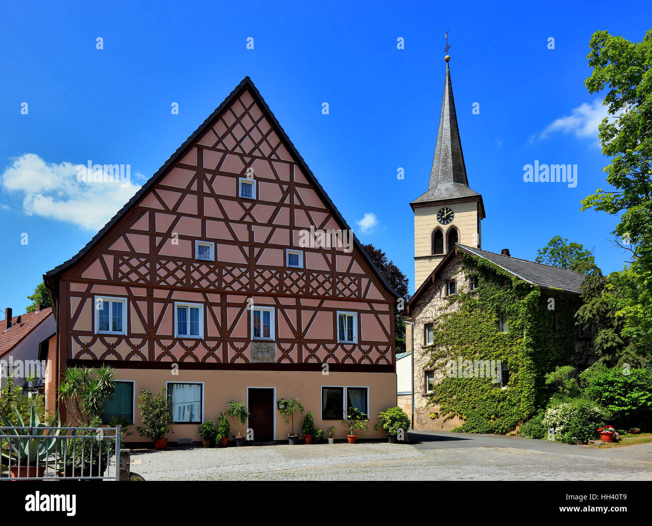 Two-storey saddle roof construction with decorative gable, former court ...