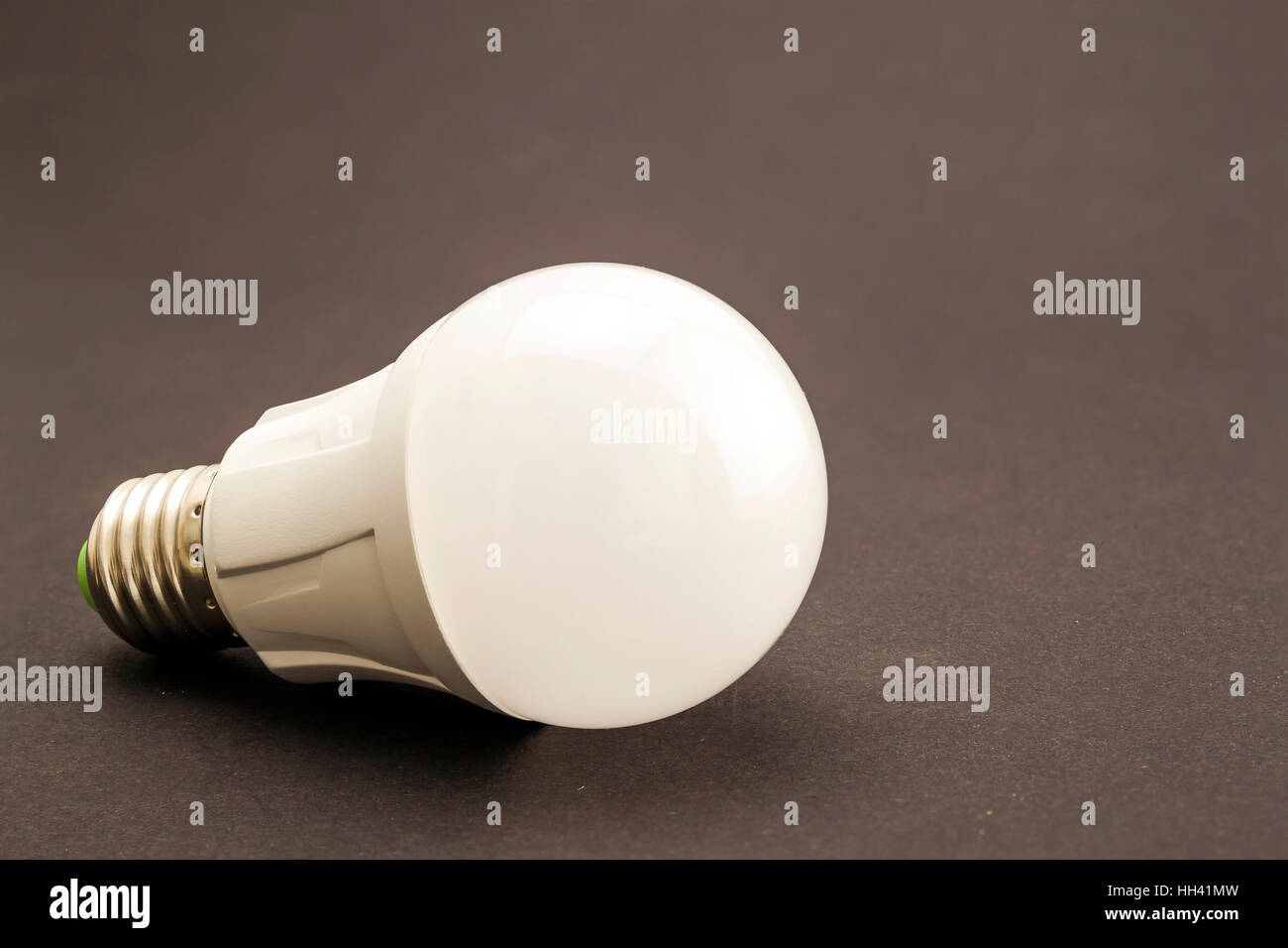 Glowing LED lamp on dark background Stock Photo - Alamy