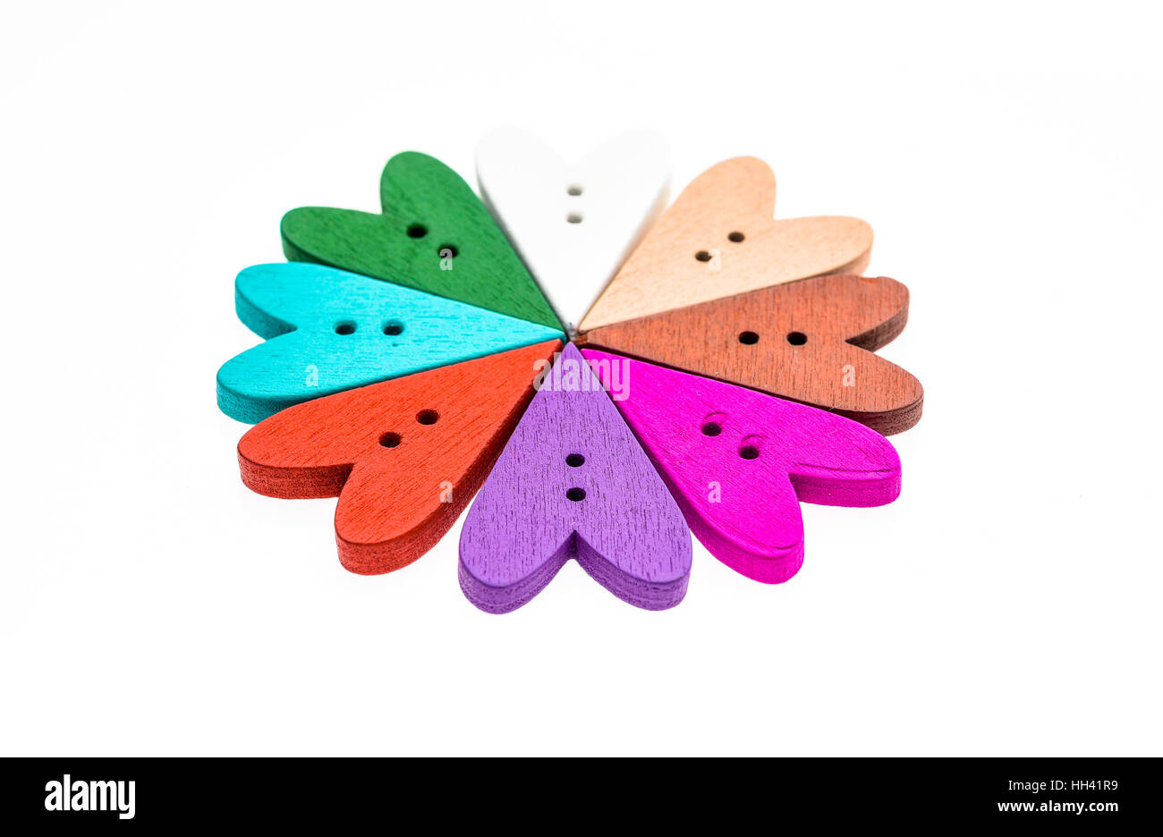 Different color heart shaped sewing buttons in a flower shape. Creative ...