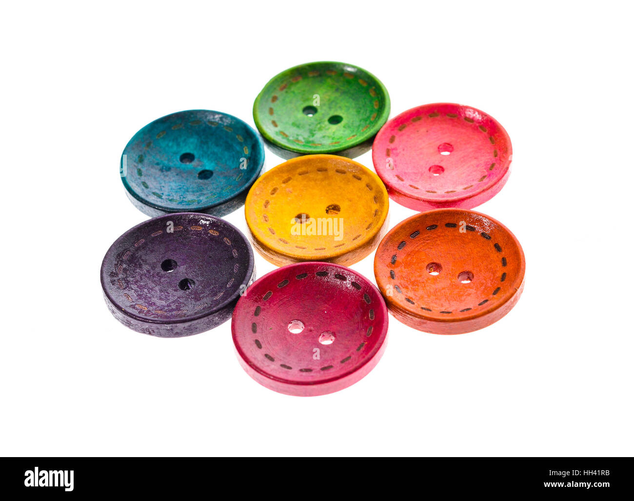 Different color, circular shaped sewing buttons in a flower shape ...