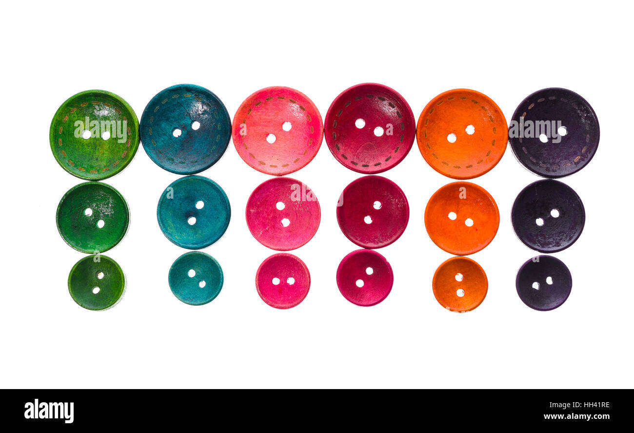 Different color and size round circular shaped sewing buttons in a row ...