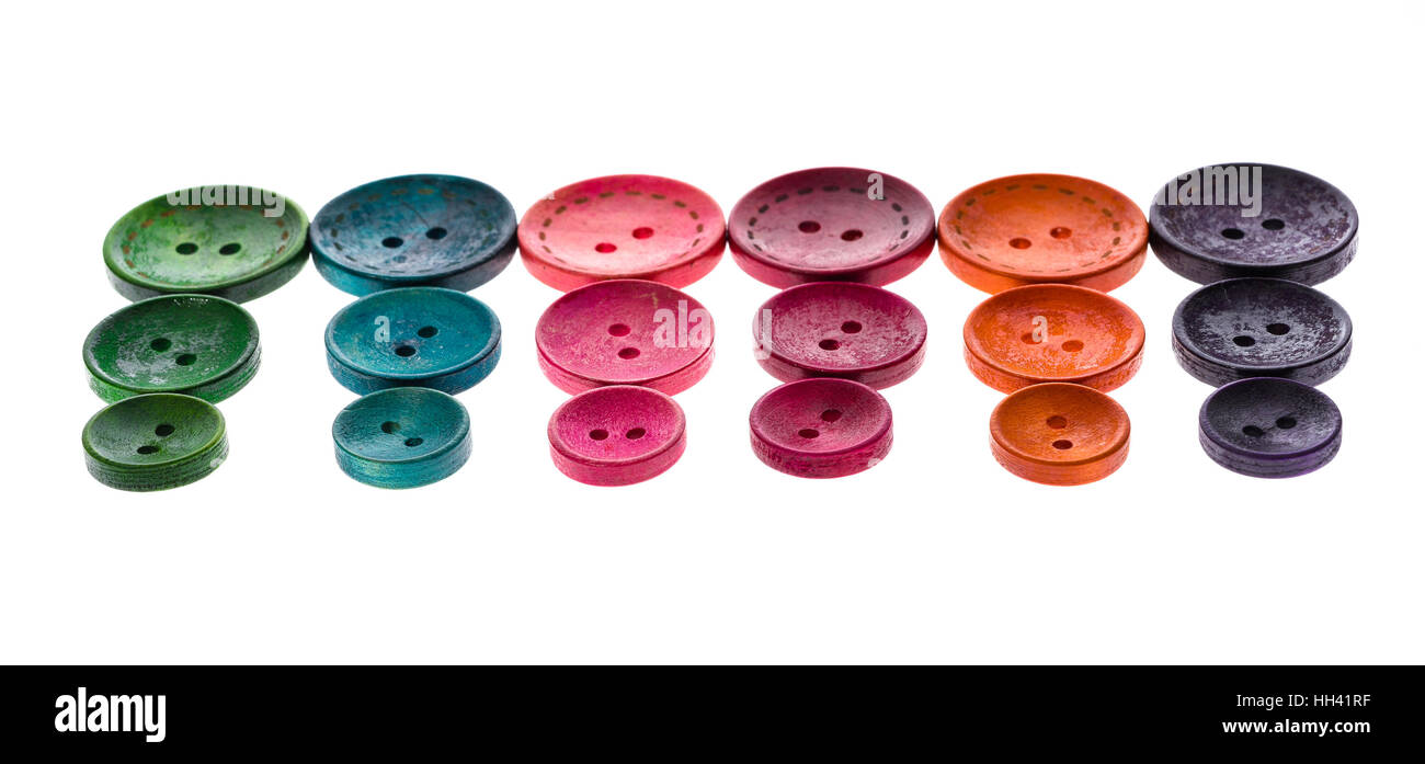 Different color and size round circular shaped sewing buttons in a row ...