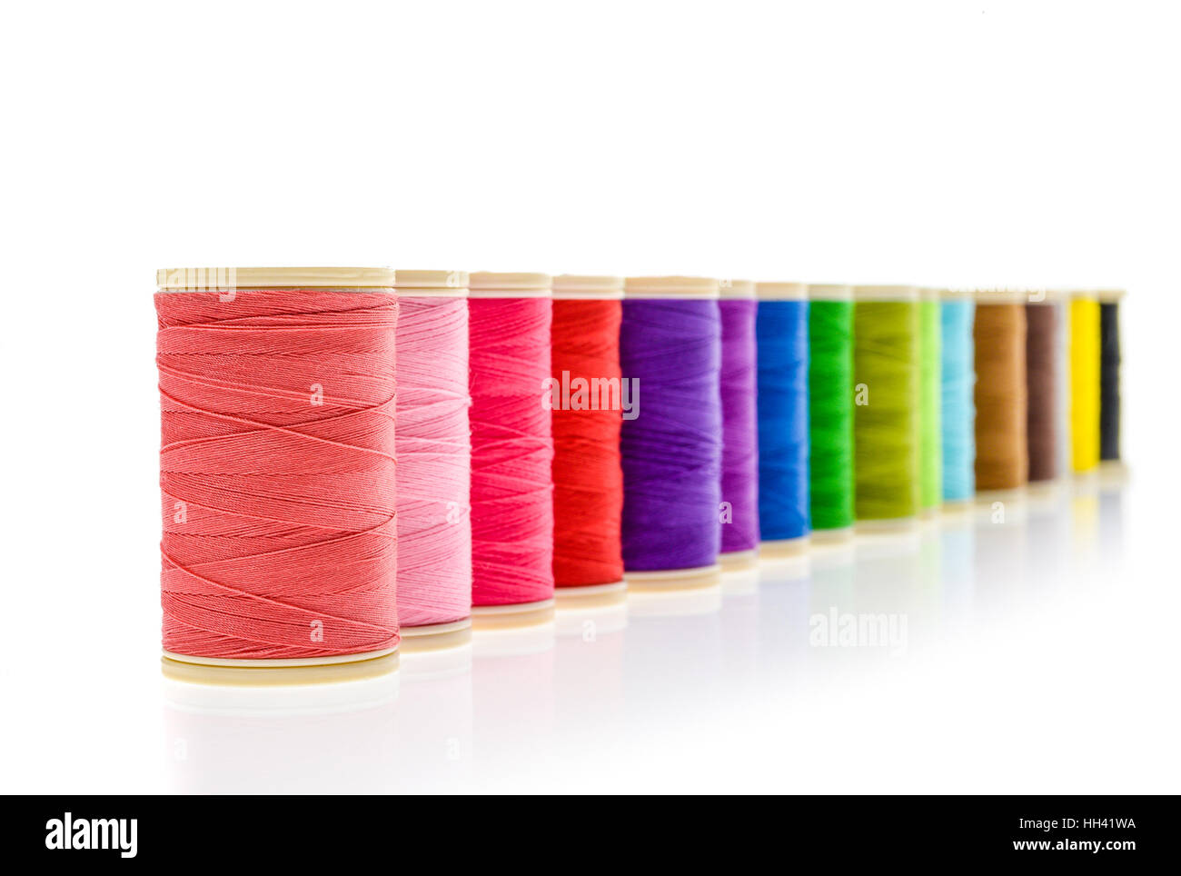 Different color Sewing Threads on a roll. Isolated on white background ...