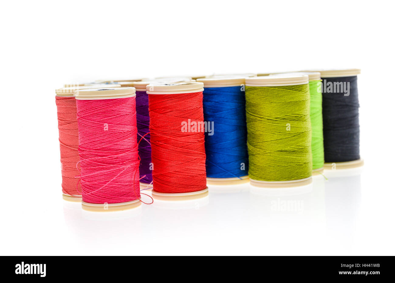 Different color Sewing Threads on a roll. Isolated on white background ...