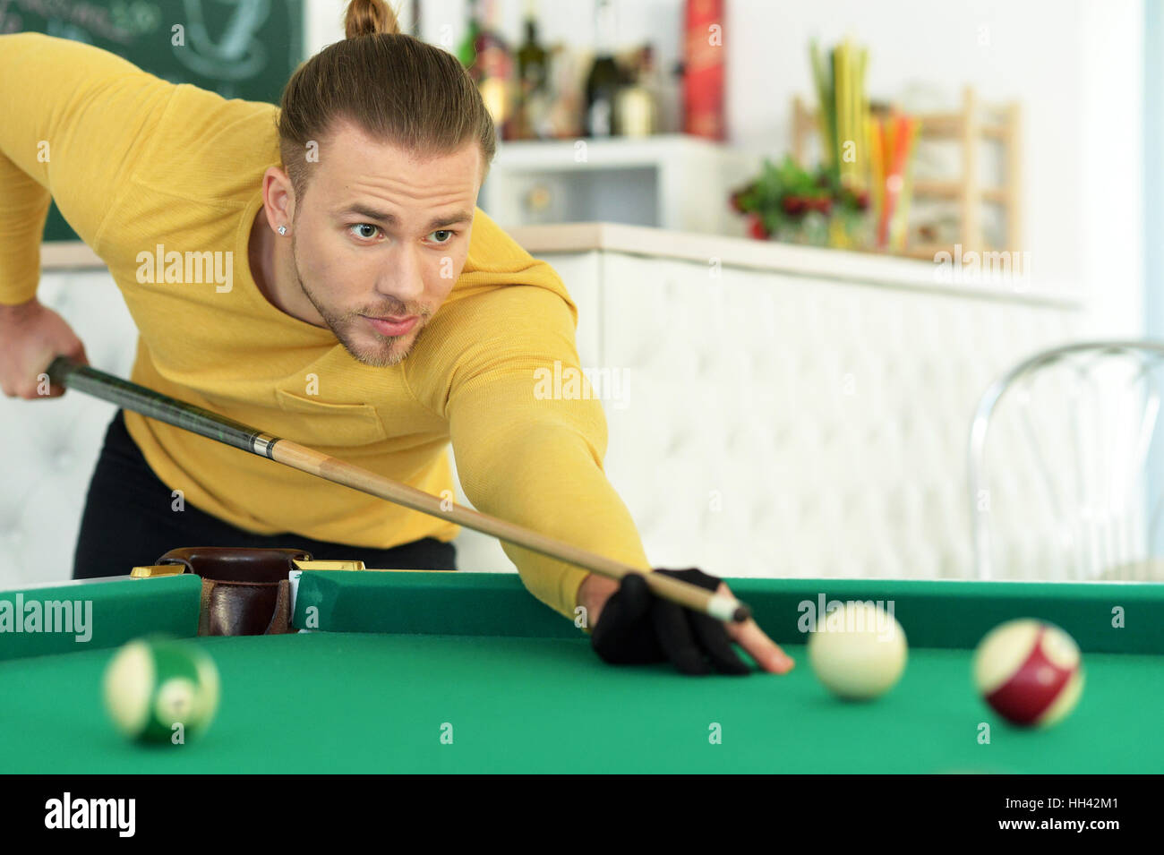 Man playing billiards Stock Photo - Alamy