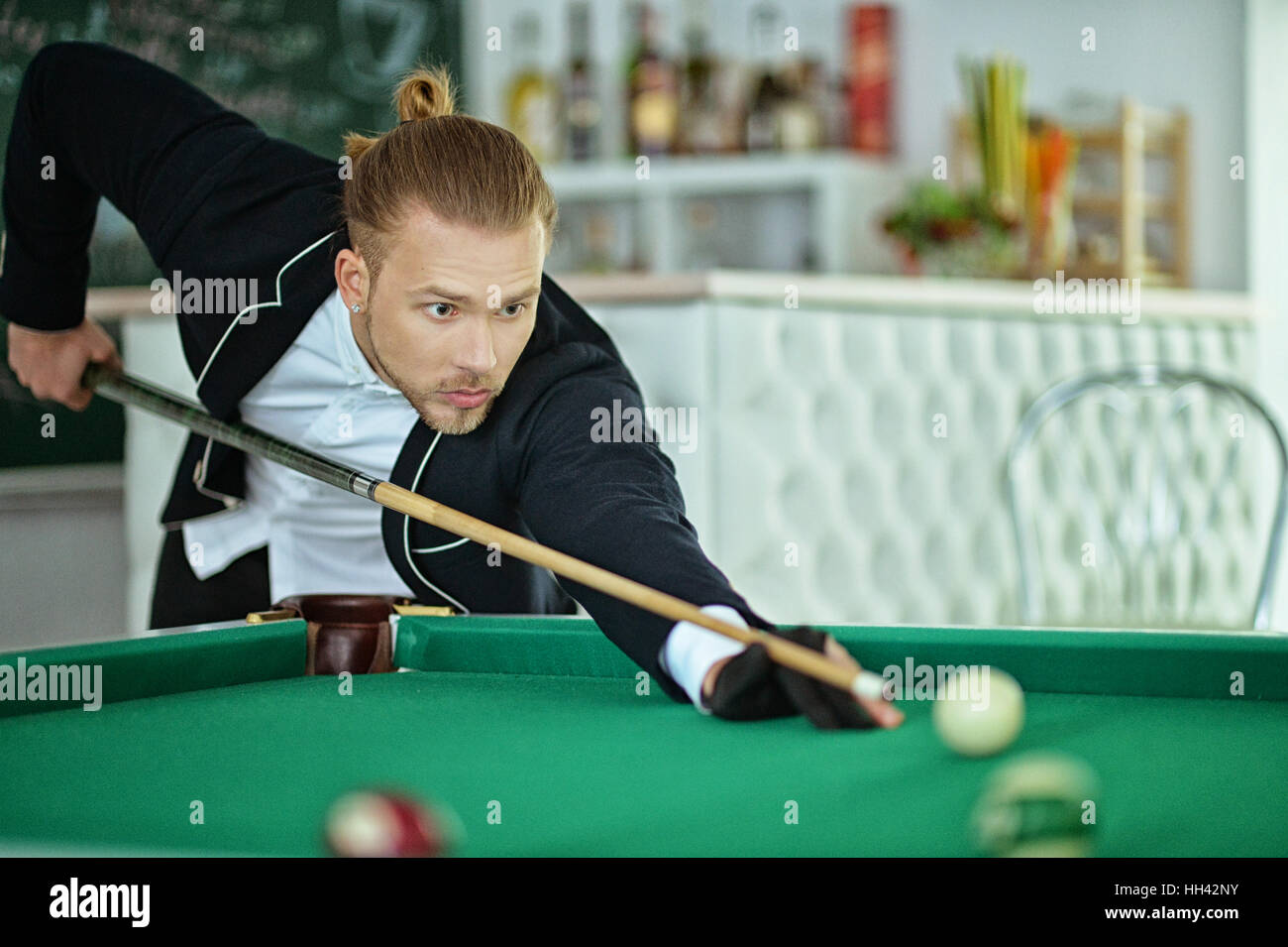 Man playing billiards Stock Photo - Alamy
