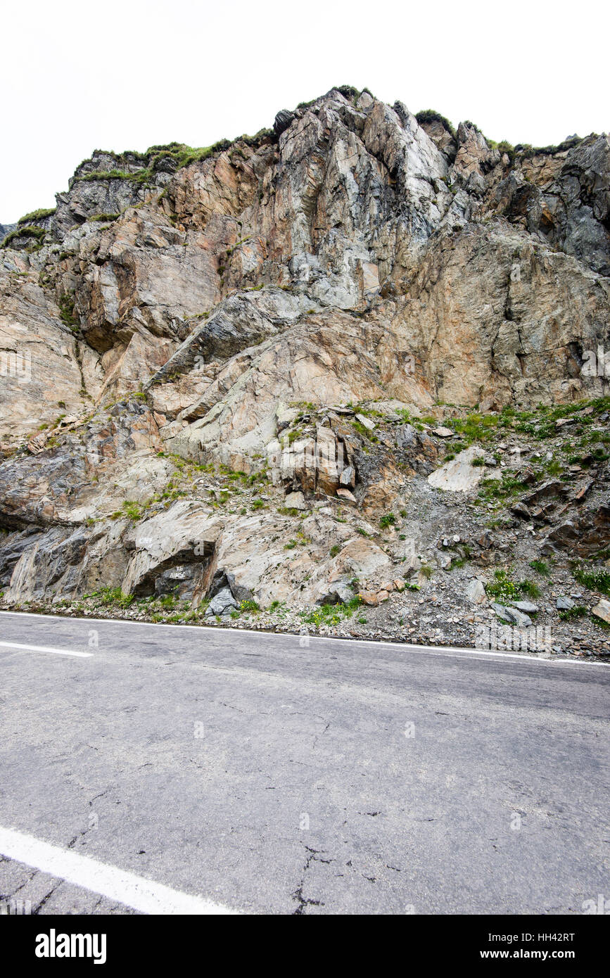 Winding country Road with clouds above and dry tarmac Stock Photo - Alamy
