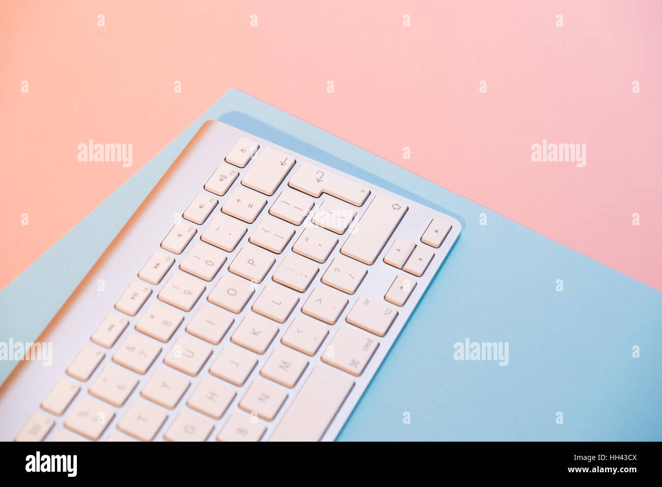 Wireless computer keyboard against pink and aqua backdrop Stock Photo ...