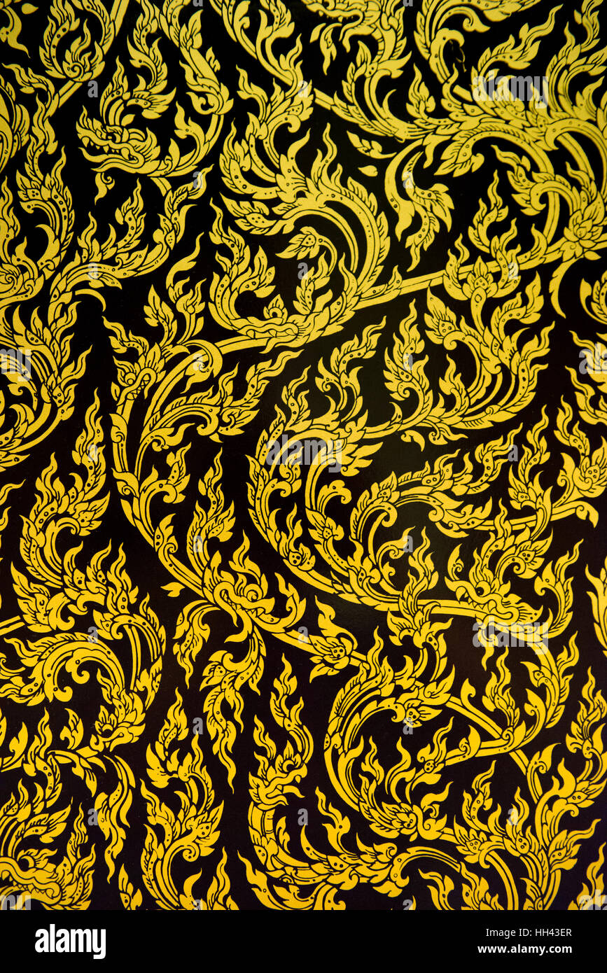 gold striped thailand on temple wall Stock Photo - Alamy