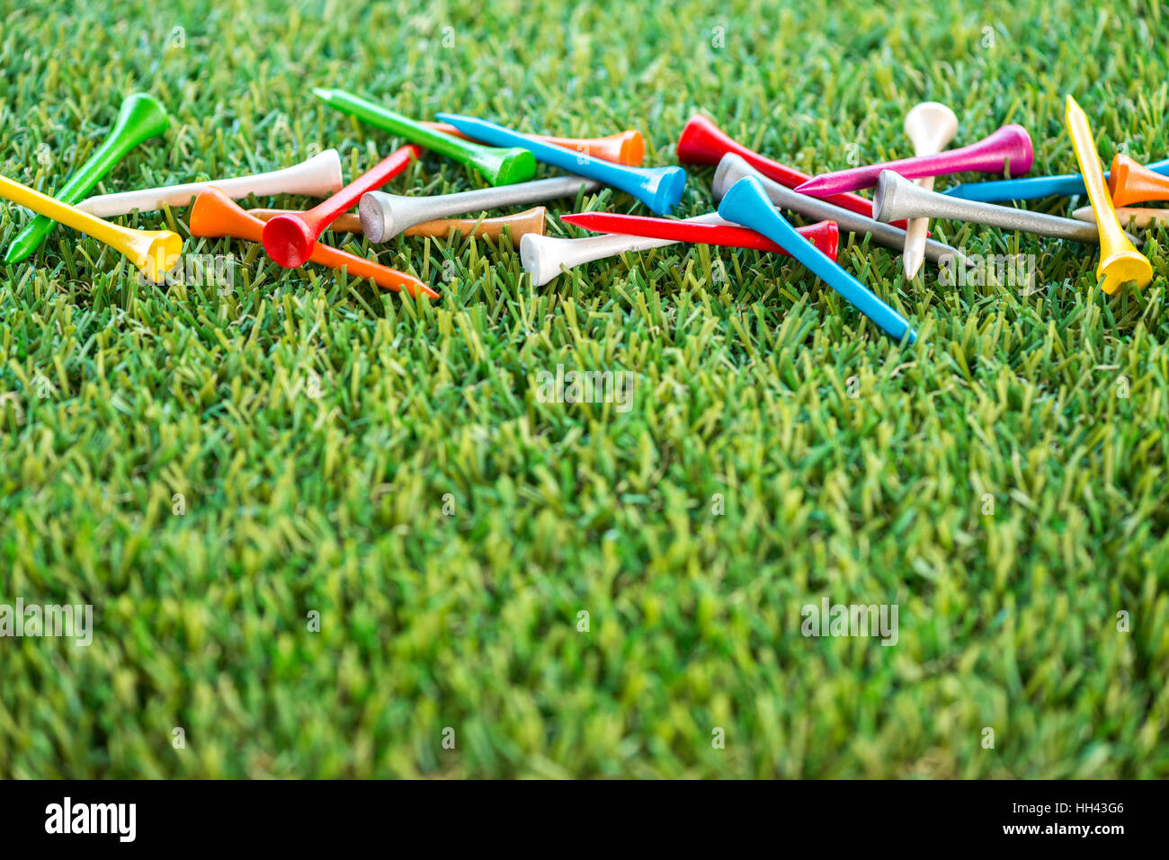 golf tee on grass in golf course Stock Photo - Alamy