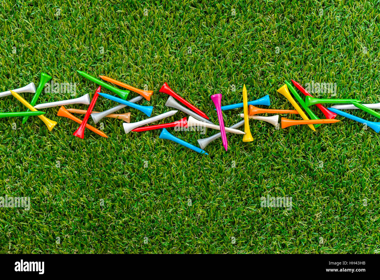 golf tee on grass in golf course Stock Photo - Alamy