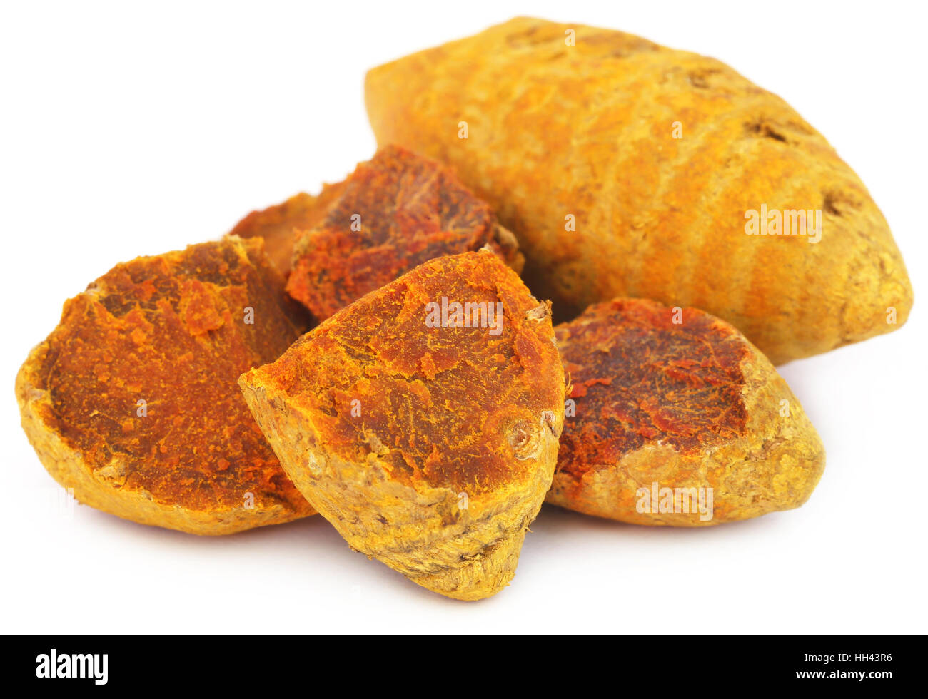 Dry turmeric over white background Stock Photo - Alamy