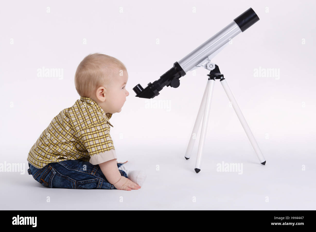 little boy with telescope exploring stars Stock Photo - Alamy