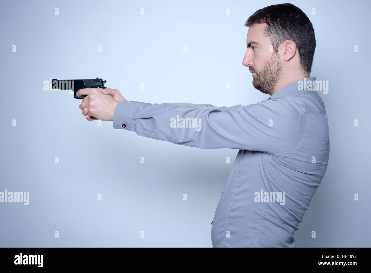 Man firing a gun hi-res stock photography and images - Alamy