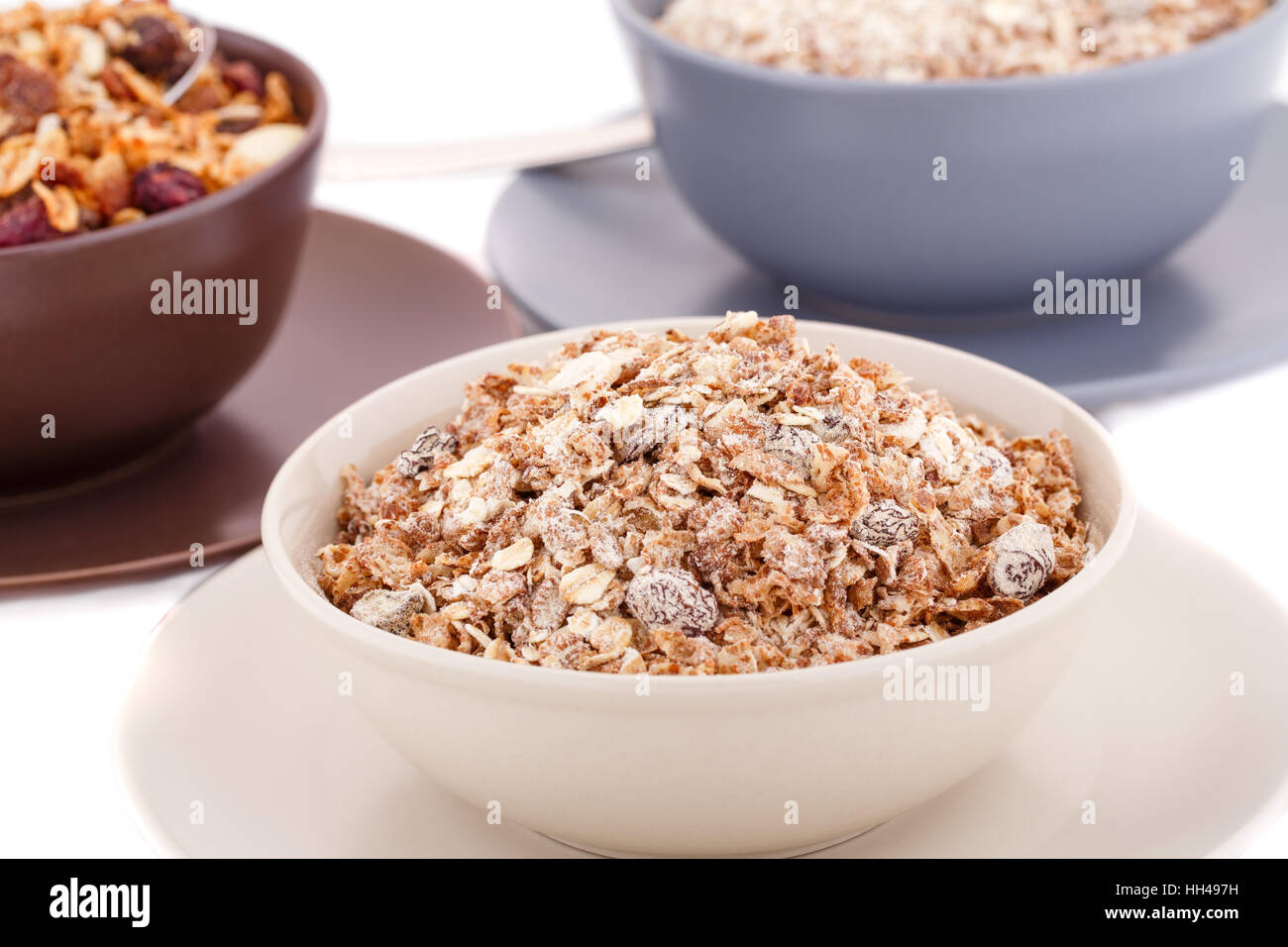 Muesli in the bowls on white background Stock Photo - Alamy