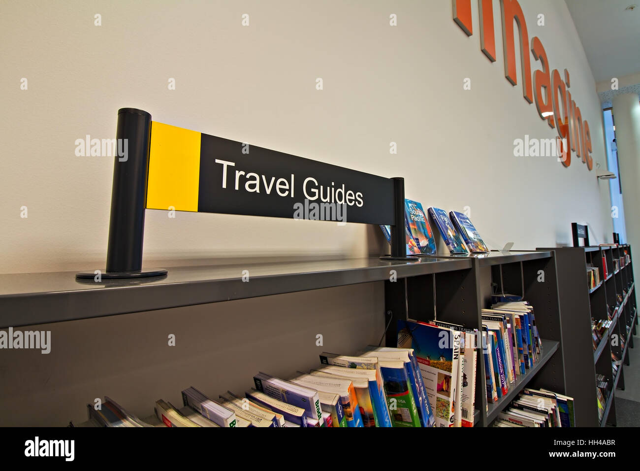 Travel Guides section inside a public library Stock Photo - Alamy