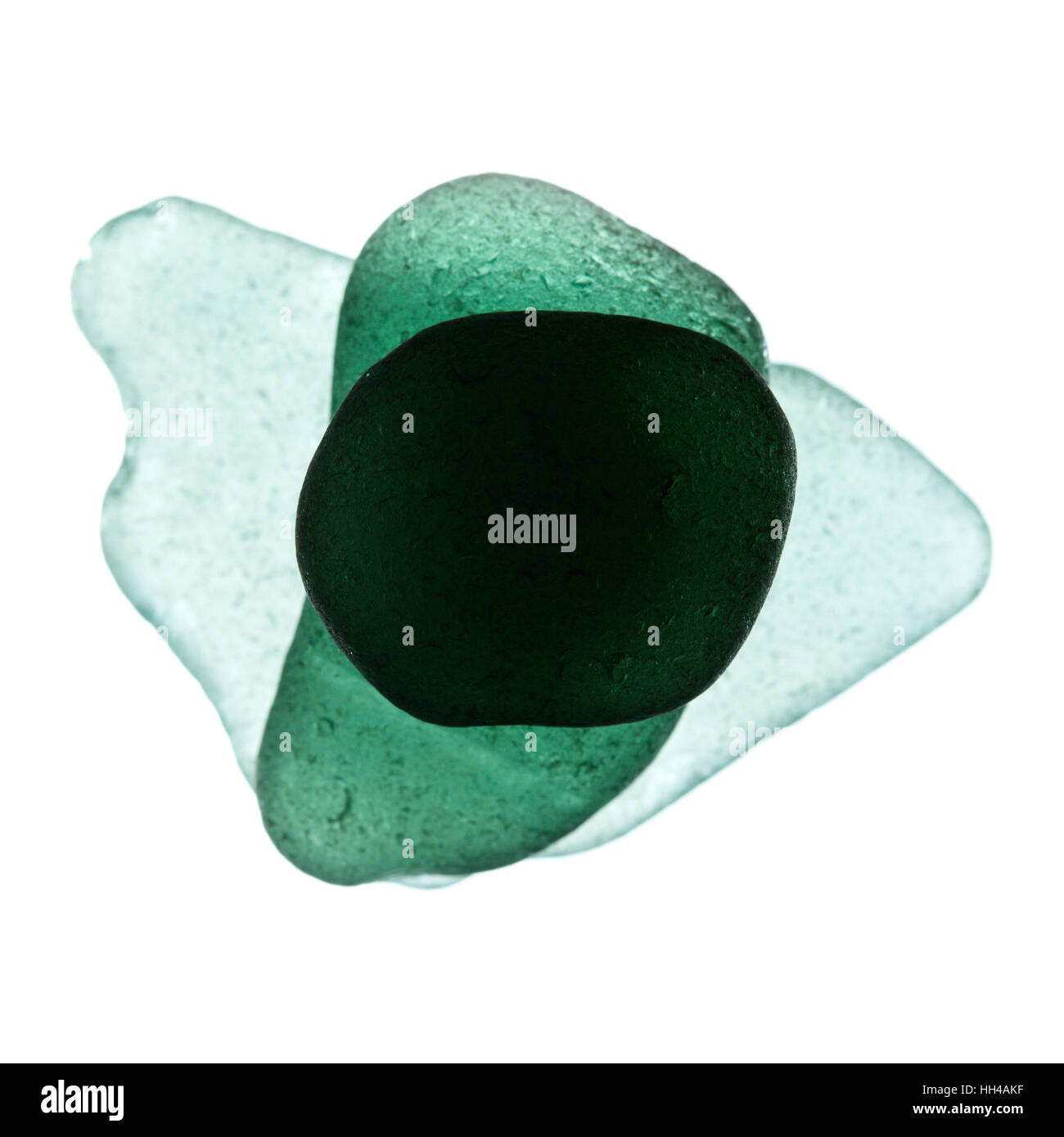 backlit sea glass peices isolated on white background Stock Photo - Alamy