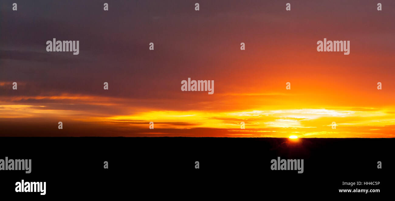 Sunset at the horizon Stock Photo - Alamy