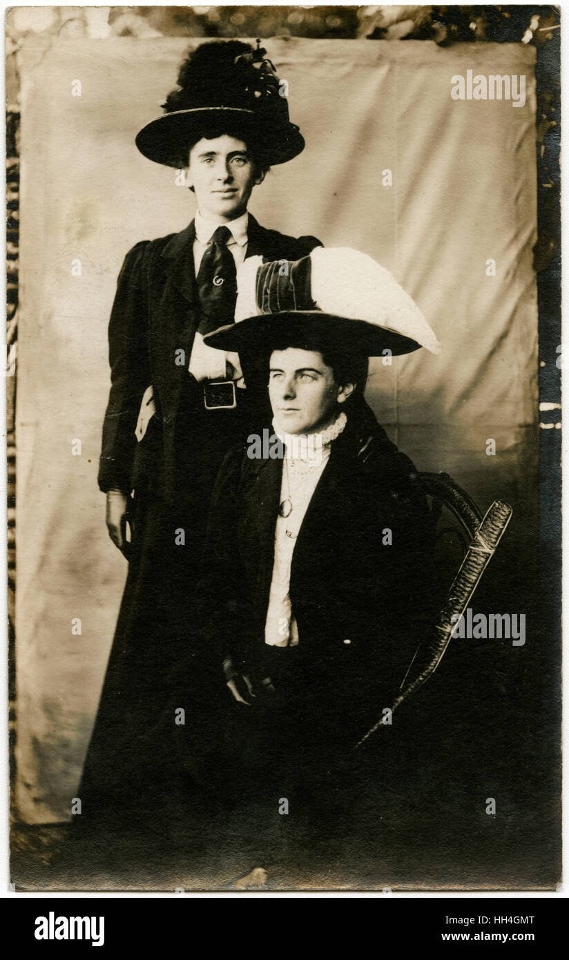 Two Edwardian men dressed as suffragettes Stock Photo - Alamy