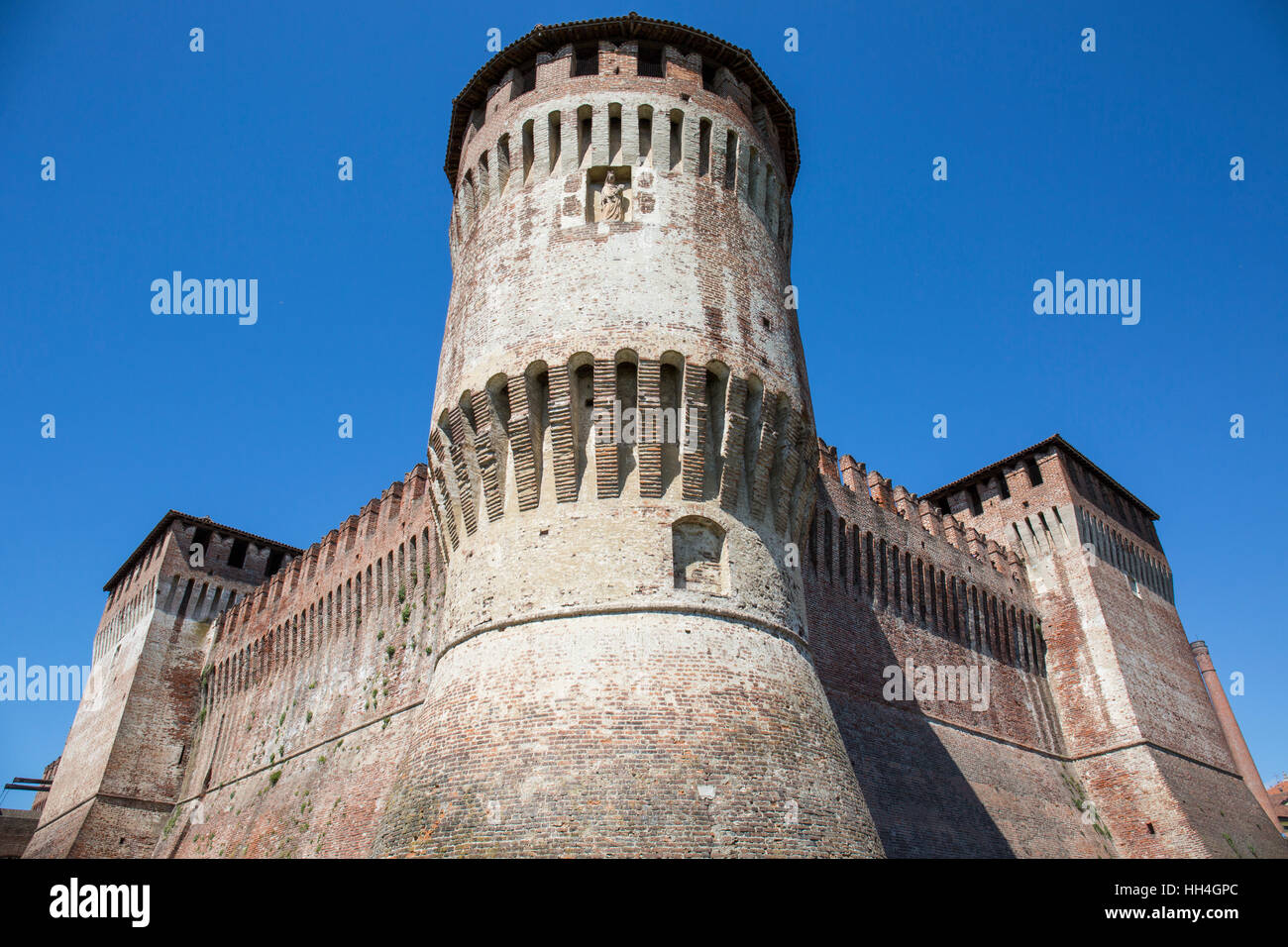 Tower of medieval italian castle on blue sky Stock Photo - Alamy