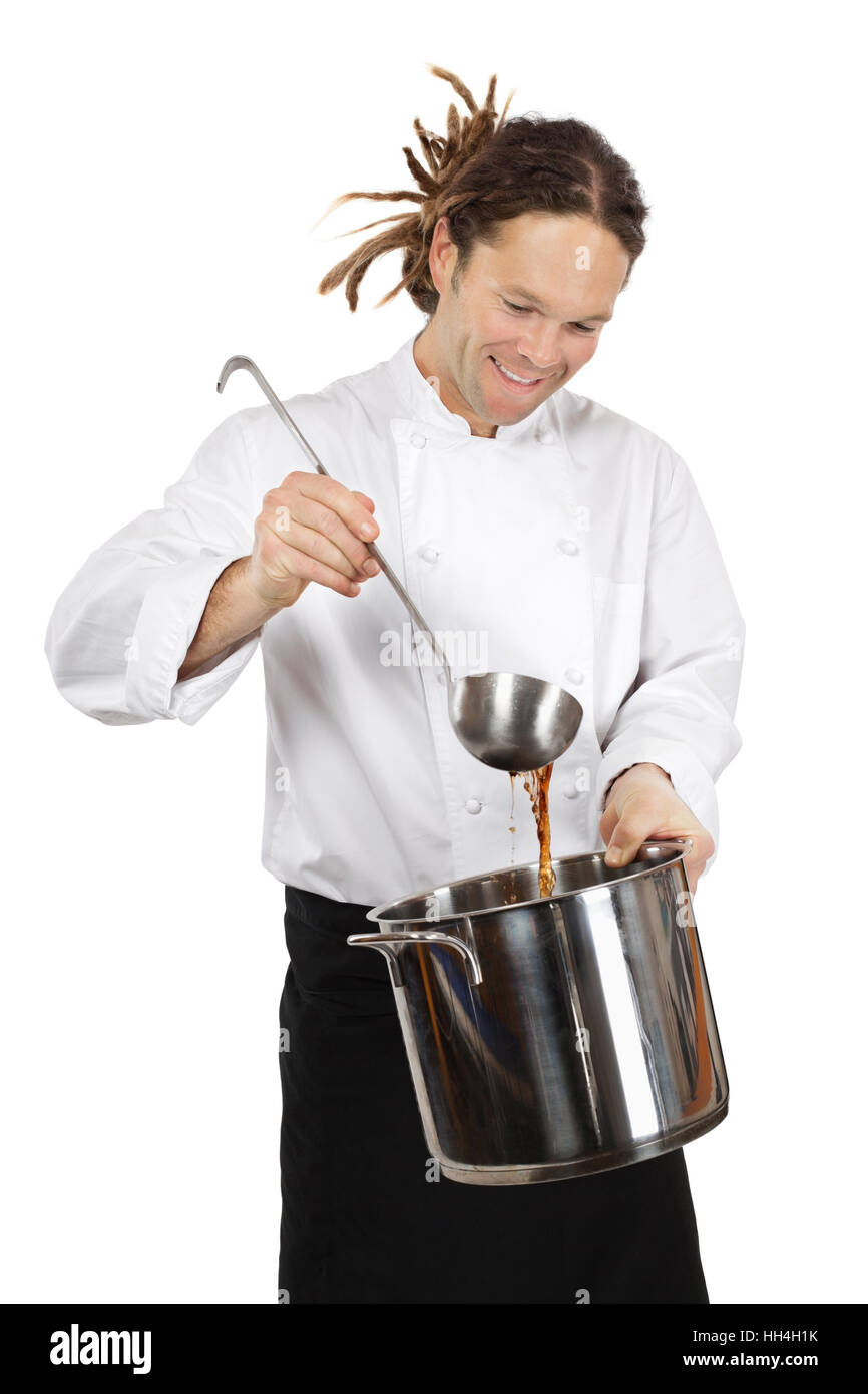 Photo of a young chef with dreadlocks holding a large cooking pot and ...